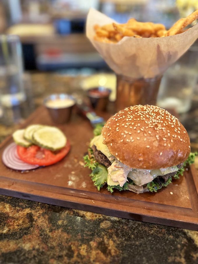 This isn't just a burger&mdash;it's an architectural marvel of beef, bun, and toppings that requires both hands and absolutely zero distractions.