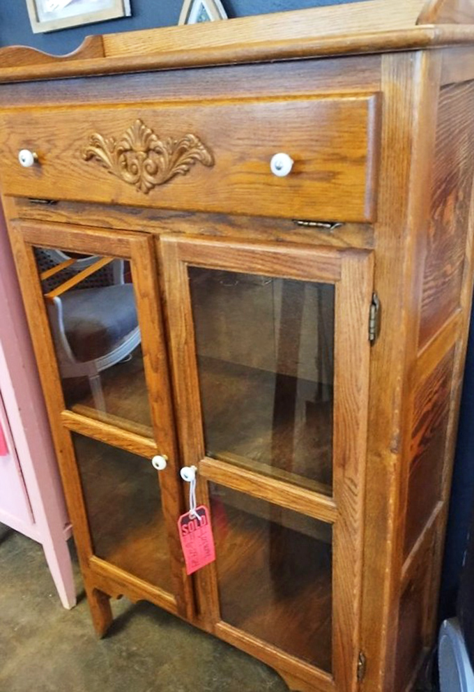 This isn't just furniture&mdash;it's a time capsule with glass doors, telling stories of the families who once stored their Sunday best inside.