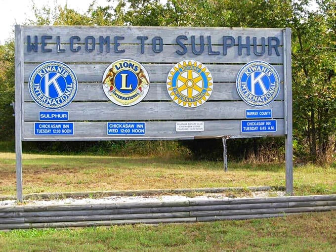 Small-town pride shines through this humble welcome sign, where civic organizations remind you that community still matters in Sulphur.