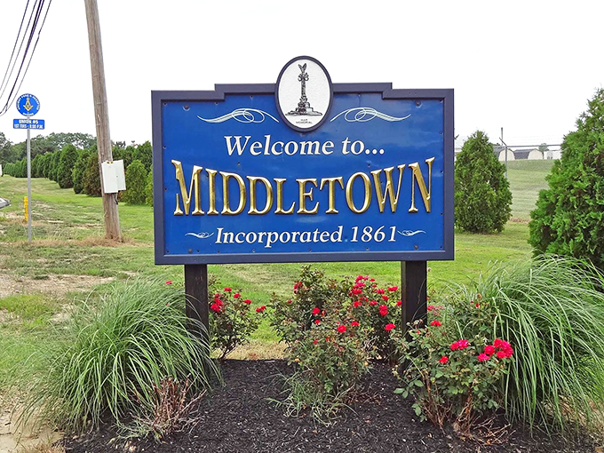 Middletown's welcome sign greets visitors with small-town hospitality. The floral display says "we care about details" in the language of petunias.