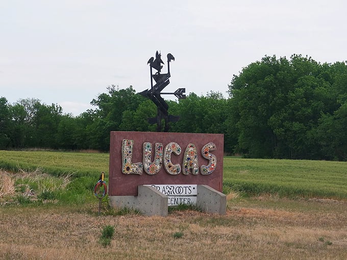 The Lucas welcome sign sparkles with found objects and recycled materials—a perfect introduction to a town where "one person's trash" becomes community treasure.
