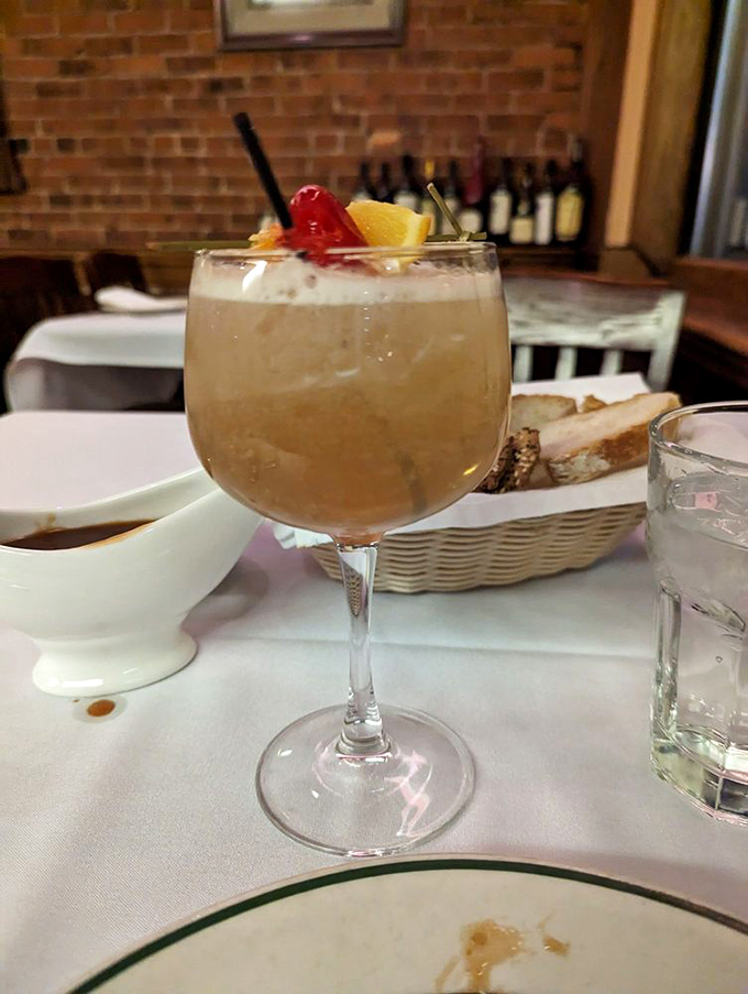 This isn't just a cocktail; it's a time machine. One sip of this whiskey sour and suddenly you're in a Sinatra-soundtracked world where phones stay in pockets.