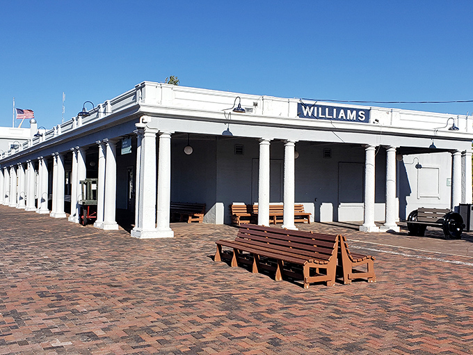 The historic Williams Station stands proudly as the southern gateway to Grand Canyon adventures. Those columns have witnessed countless journeys begin with excited whispers.