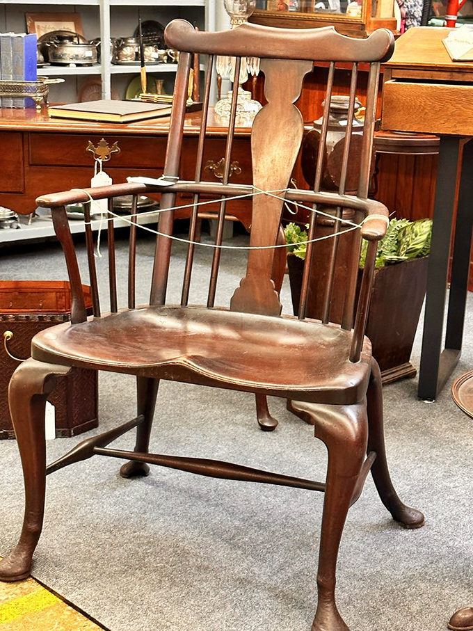 Not just a chair, but a throne of craftsmanship. Someone shaped each curve and spindle long before "artisanal" became a marketing buzzword.
