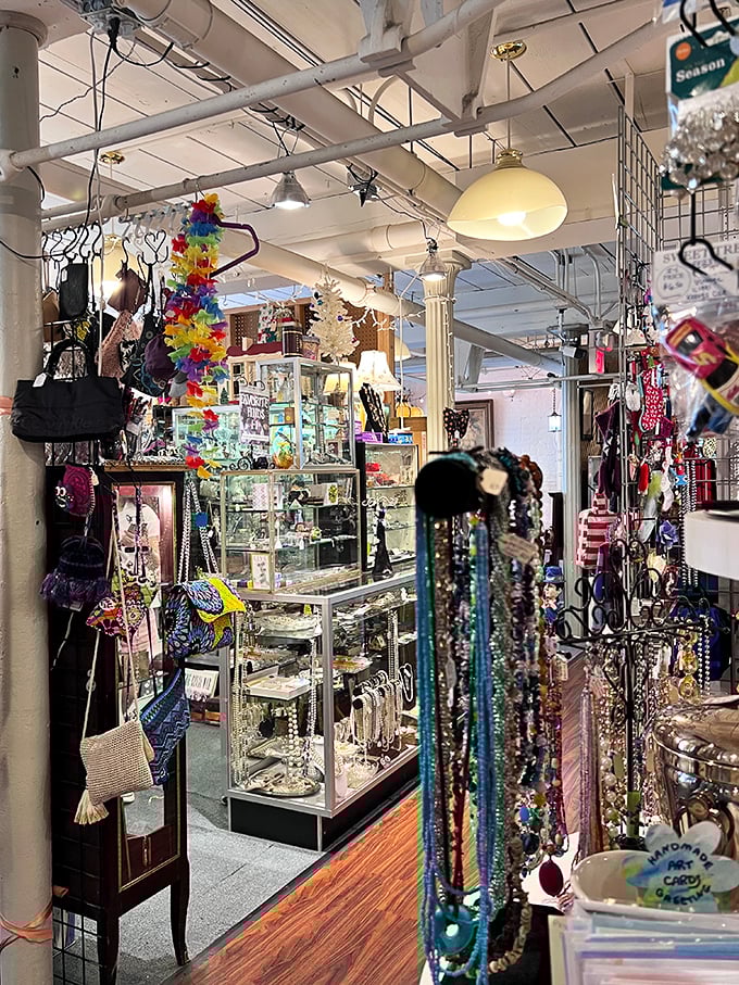 Necklaces cascade like colorful waterfalls amid display cases of treasures. The perfect accessory for your next "I found this at an antique shop" humble brag.