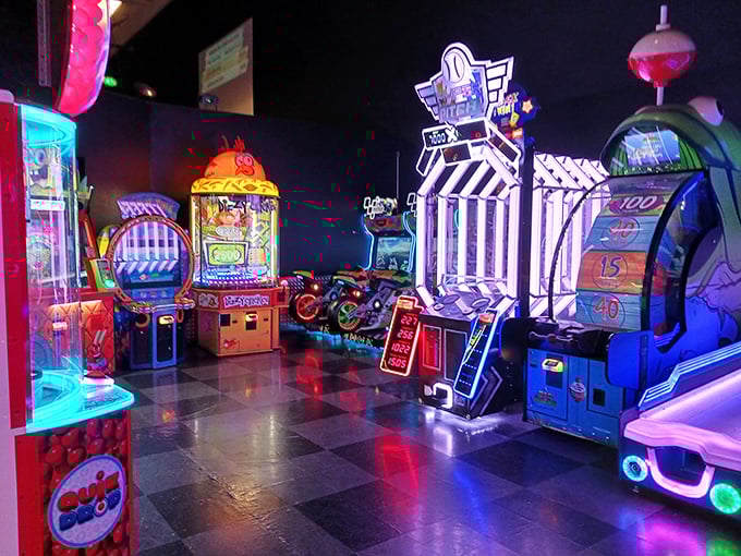 Between races, digital redemption awaits. Because nothing says "I'm a well-rounded competitor" like dominating both tracks and arcade games.