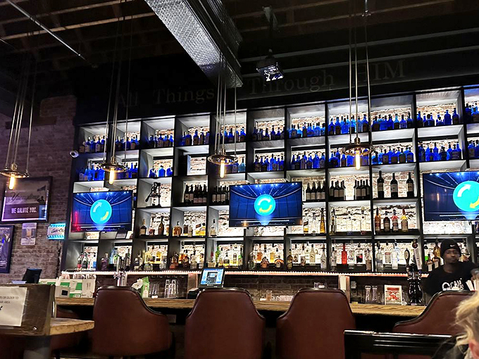 The bar's blue-lit bottle display isn't just storage&mdash;it's a liquid art installation that promises sophisticated pairings for your seafood adventure.