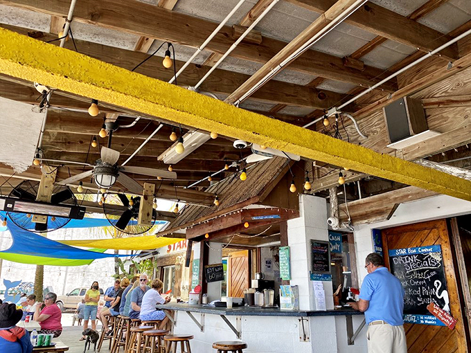 The ordering counter where dreams come true &ndash; no-frills service under rustic wooden beams and colorful shade sails.