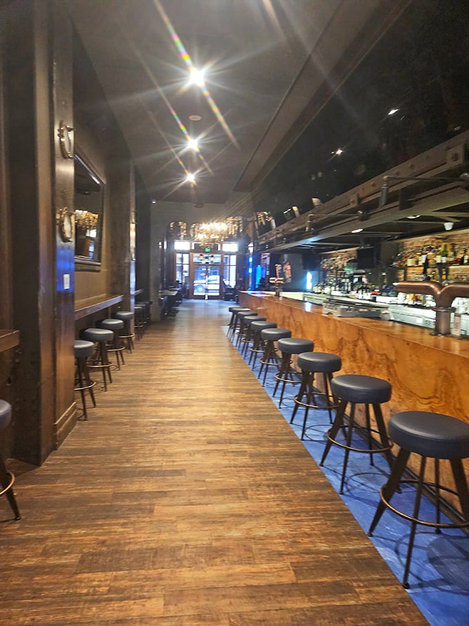 A long wooden bar with comfortable seating invites patrons to stay awhile. The perfect perch for people-watching and mermaid-spotting.