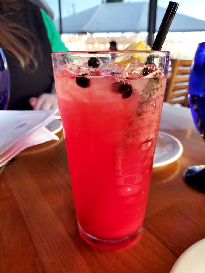 Berry-infused brilliance in a glass. This refreshing ruby-colored cocktail with floating berries is what summer tastes like if it took bartending classes.