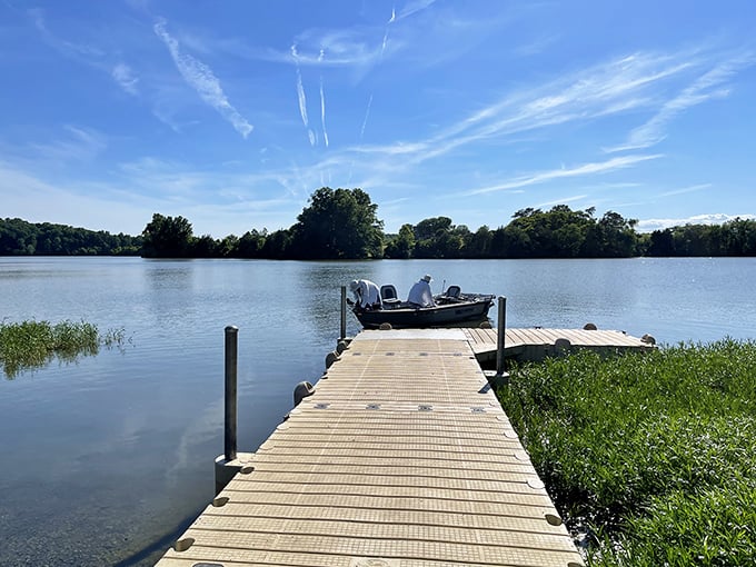 A wooden dock stretching into calm waters&mdash;nature's invitation to slow down. In our hyperconnected world, this simple fishing spot is the ultimate luxury.