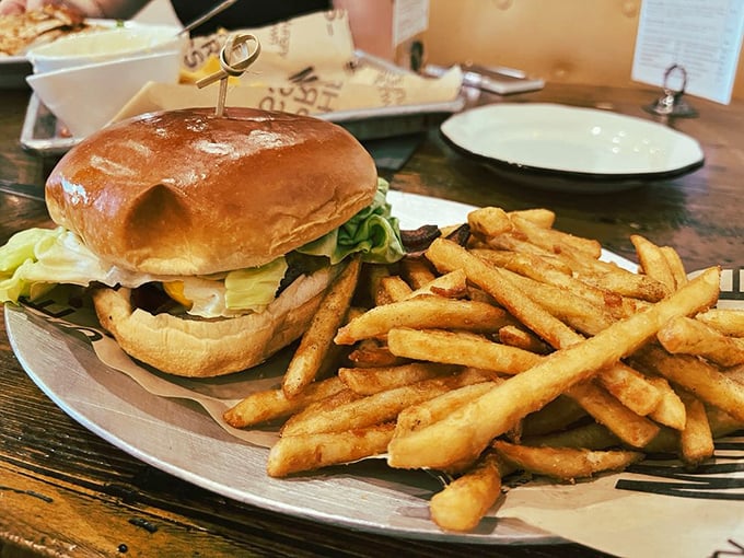 A burger that demands to be photographed before eaten. The glossy bun, the fresh greens, and those hand-cut fries&mdash;this is Oklahoma's answer to food envy. 