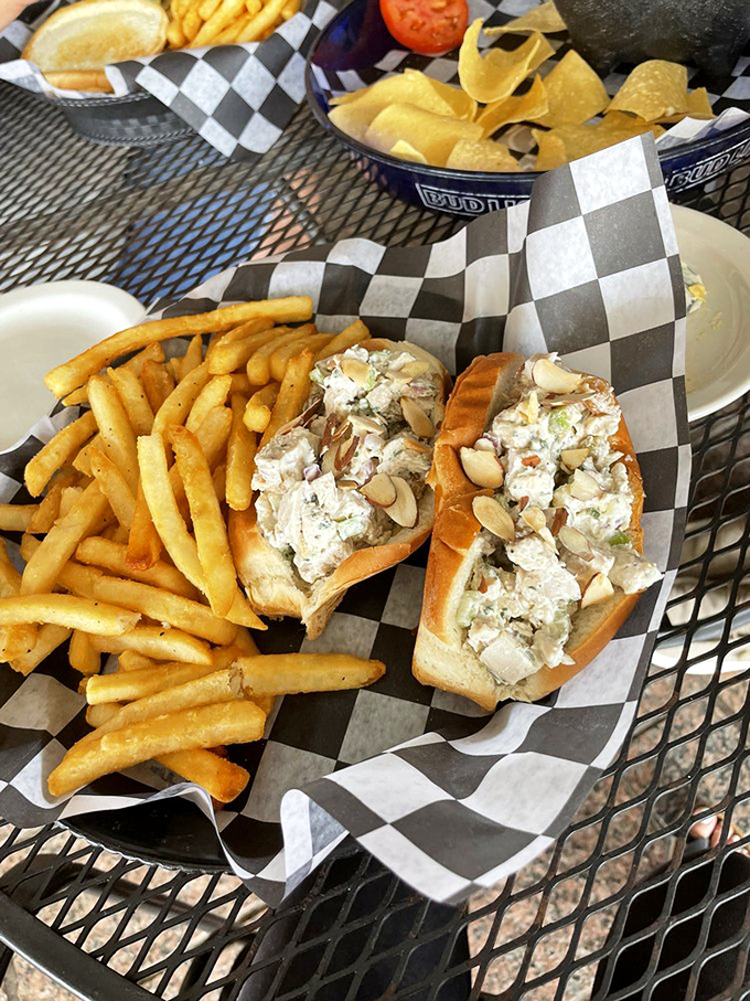 Two chicken salad rolls nestled beside golden fries&mdash;proof that sometimes the simplest combinations deliver the most satisfying culinary hugs.