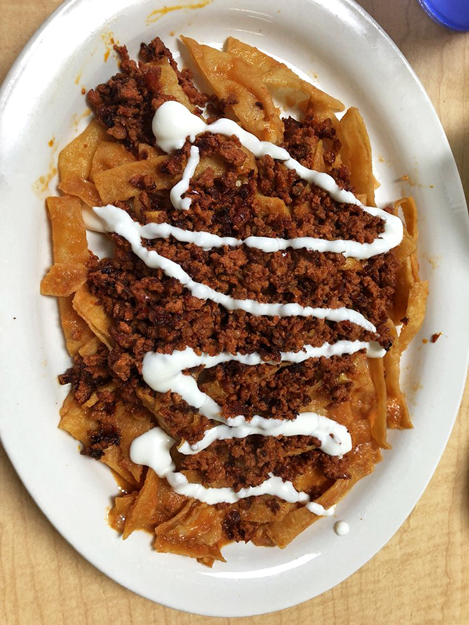 Chilaquiles: where tortilla chips go to heaven. This chorizo-topped version is the breakfast of champions who know life's too short for cereal.