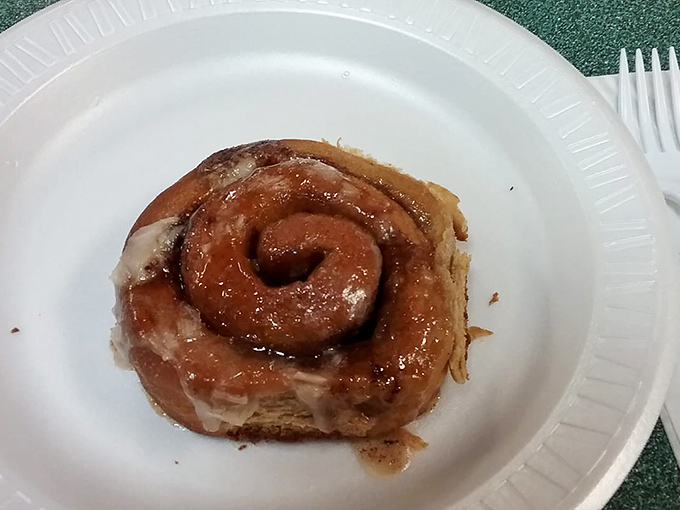 This cinnamon roll isn't trying to be Instagram-famous&mdash;it's too busy melting hearts with its gooey center and perfectly sweet glaze. Worth every sticky finger.