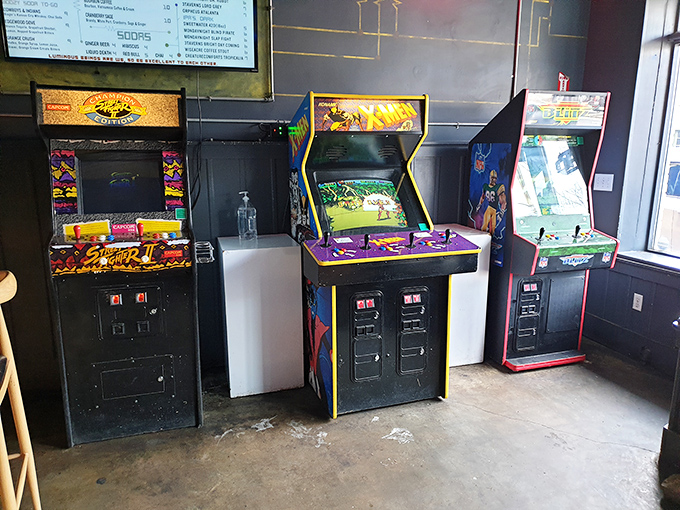 Street Fighter II stands ready for battle alongside other arcade legends – these cabinets have witnessed countless virtual knockouts and victory dances.