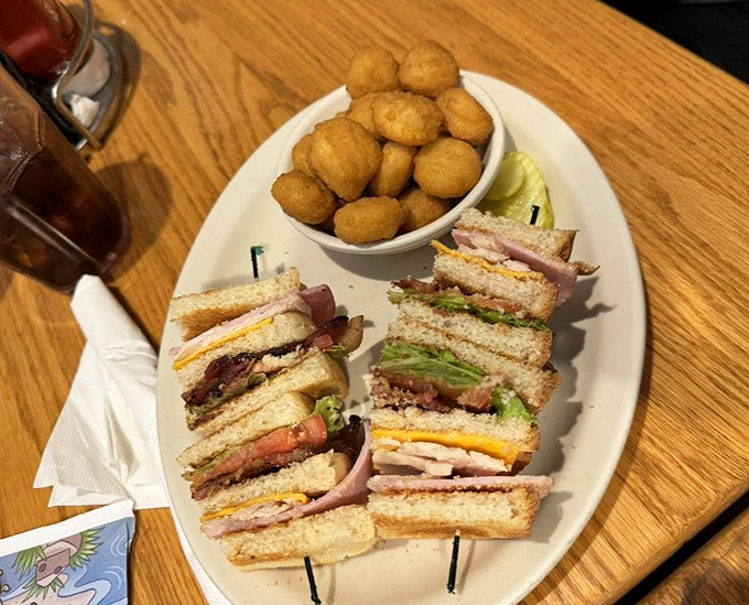 Club sandwich architecture at its finest &ndash; multiple stories of deli goodness with a side of those potato puffs that nobody can resist.