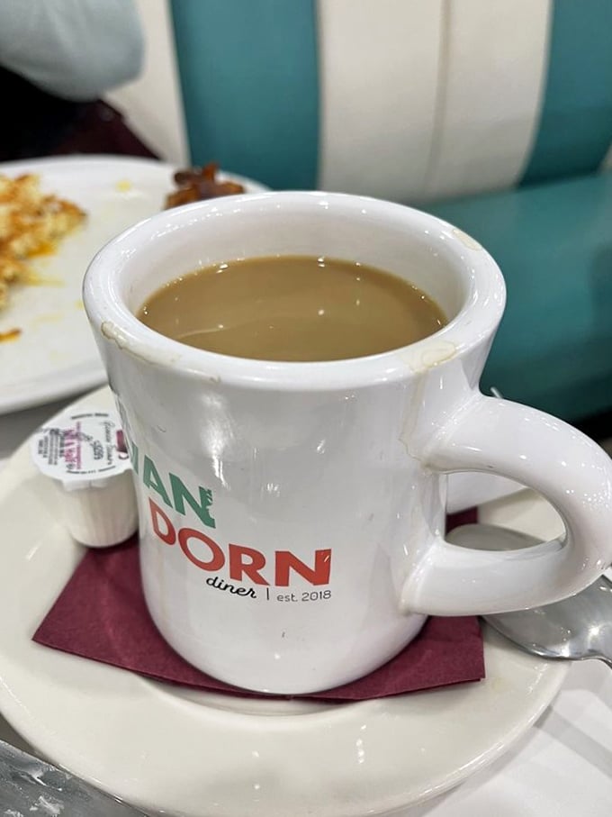 Coffee served in a mug that means business. The Van Dorn branded cup promises the kind of caffeine commitment that gets you through Monday meetings.