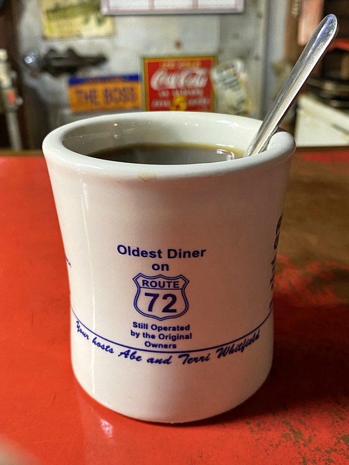 The mug proudly proclaims "Oldest Diner on Route 72" - and that coffee has probably witnessed more Mississippi stories than a courthouse bench.