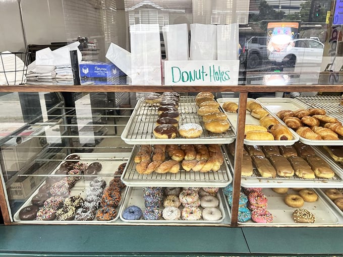 Behind this counter, magic happens daily—where flour, sugar, and skill combine to create memories disguised as pastries.