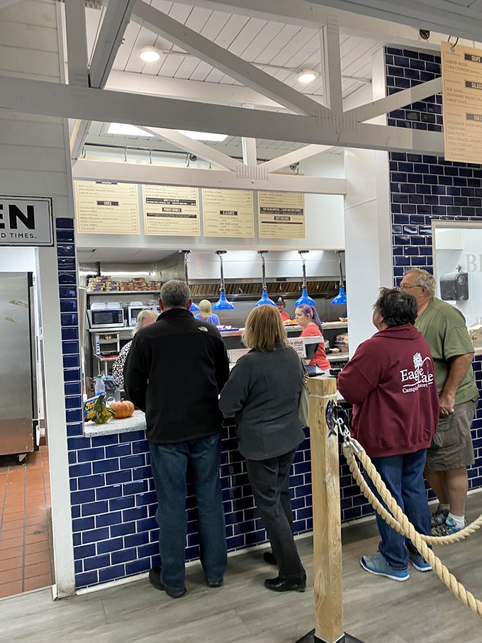 The ordering counter &ndash; where seafood dreams begin their journey to reality. Blue tile and pendant lights create that "you've arrived somewhere special" feeling.