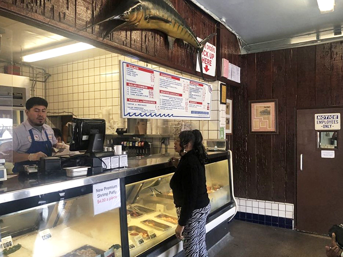 Where seafood dreams begin. The ordering counter at Fisherman's Outlet &ndash; simple, straightforward, and the gateway to fried fish nirvana.