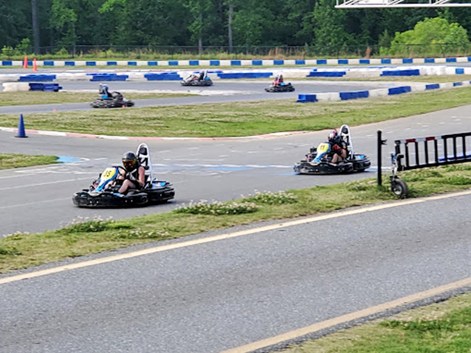 Two karts navigate the course like synchronized dancers, finding that perfect line between speed and control.