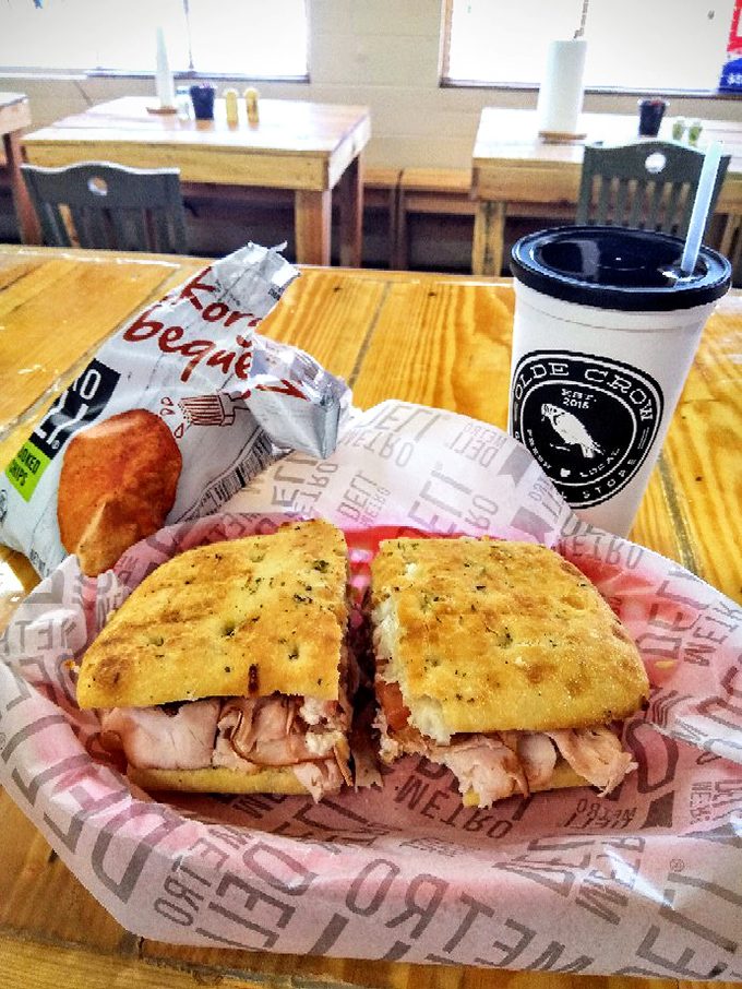 Turkey and herbs nestled between focaccia that's clearly been to finishing school. The chips are just there for moral support.