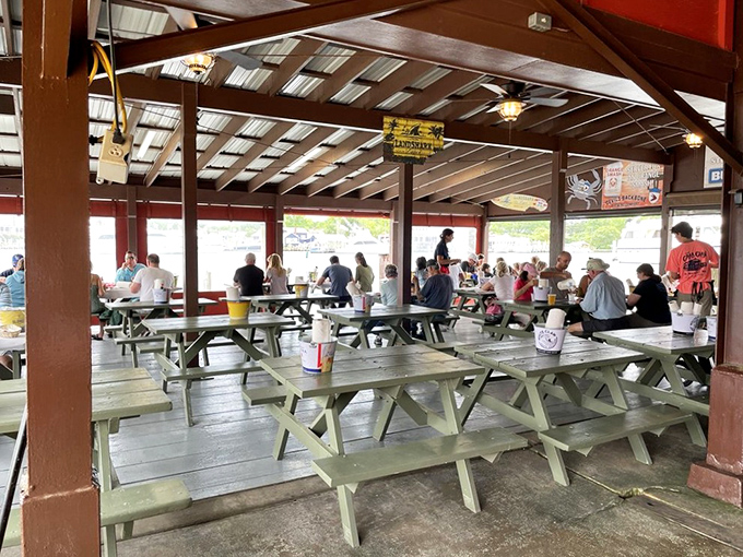 "Welcome to The Crab Claw!" proclaims the sign, while the lighthouse lamp stands ready to guide hungry travelers to seafood nirvana.