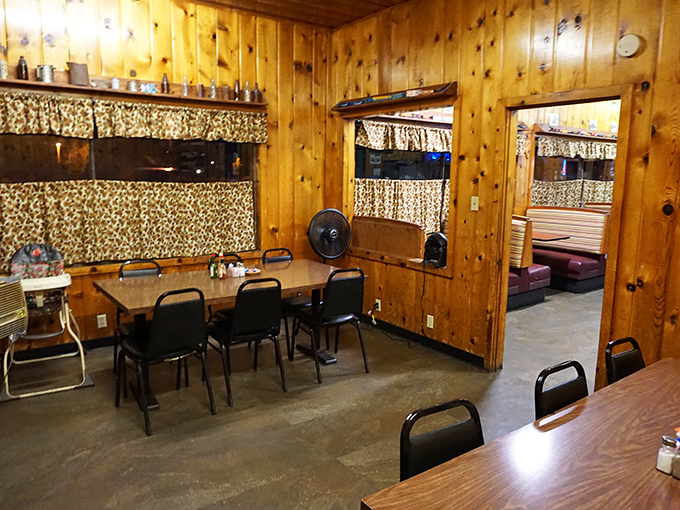 Wood-paneled walls have absorbed decades of stories, while leopard-print curtains add that touch of Wild West glamour every diner secretly needs.