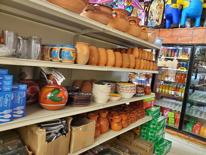 The market shelves tell stories of home cooking traditions. Each clay pot and colorful dish promises to bring a touch of Mexico to Kansas kitchens.