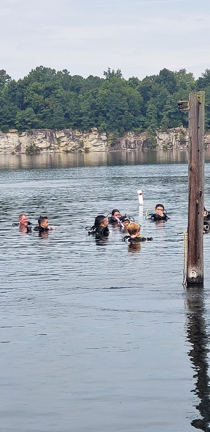Beneath the surface adventures! These scuba enthusiasts discover Fantasy Lake's underwater secrets while the rest of us focus on staying atop those wobbly floating platforms.