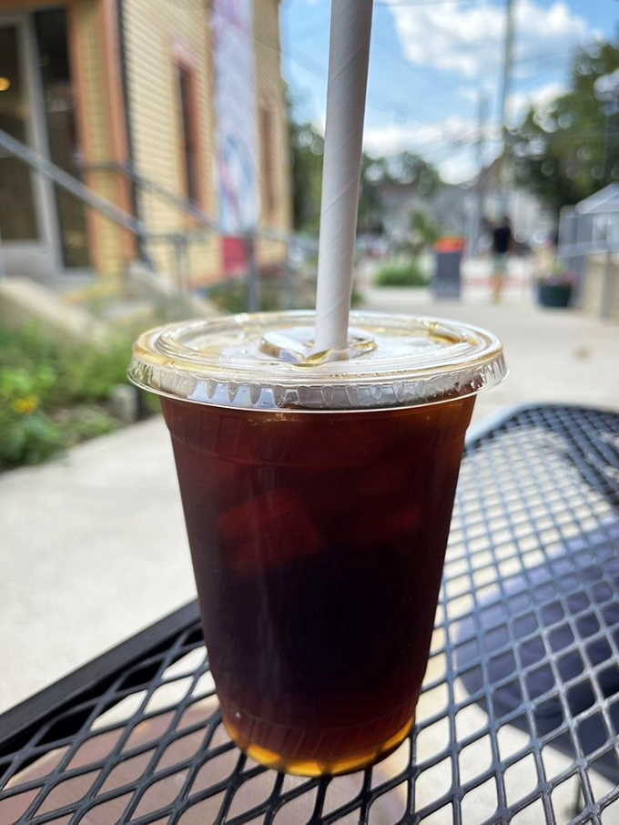 Cold brew on a hot day outside Zingerman's&mdash;the caffeine companion to your sandwich adventure. Like Batman to your culinary Robin.