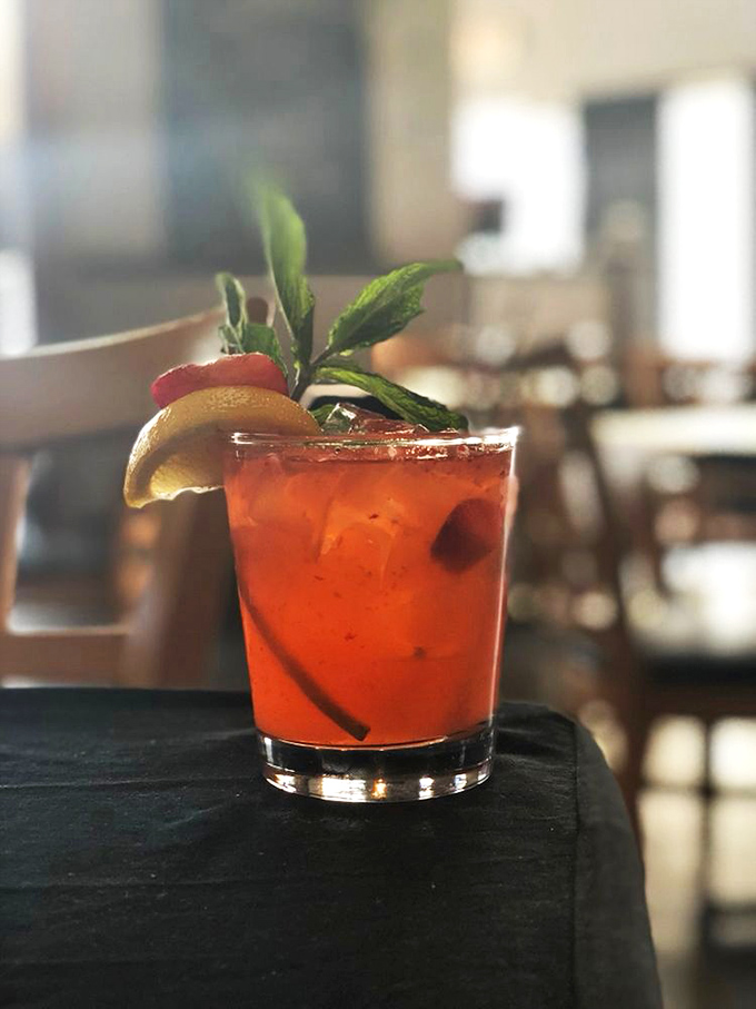 This isn't just a cocktail; it's summer in a glass. The fresh mint and citrus garnish aren't just for show—they're promising you flavor complexity that soda could never deliver.