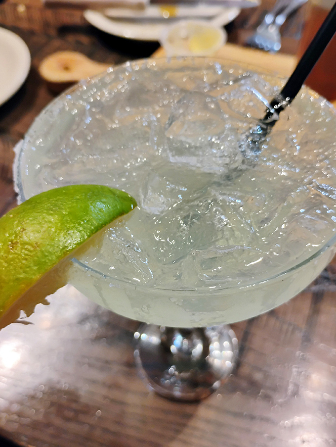 A margarita so clear and inviting it practically whispers "vacation" with each ice cube clink. That lime isn't garnish&mdash;it's punctuation.