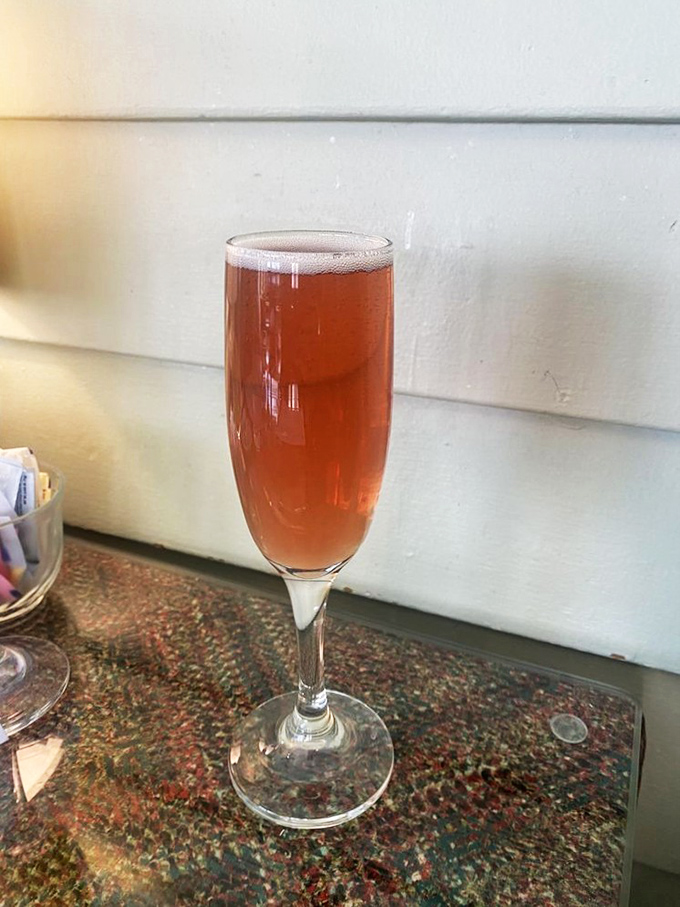 A champagne cocktail that's wearing a sunset-colored dress and is ready to turn your brunch into an occasion worth remembering.