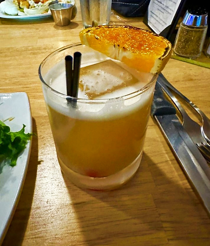 The cocktail equivalent of a mountain sunset &ndash; amber liquid catching the light, promising relaxation after a day of Blue Ridge adventures.