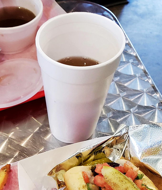 Even the beverages at Loops understand their supporting role – simple cups, no fancy garnishes, just honest refreshment for between-bite hydration.