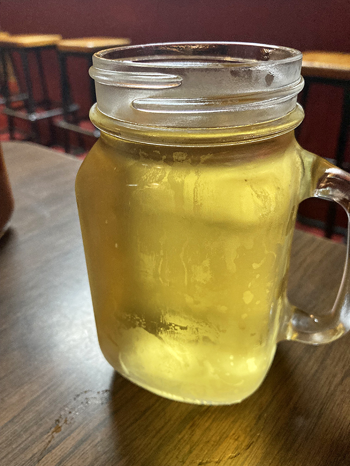 Cold beer in a mason jar &ndash; nature's perfect palate cleanser between bites of smoky ribs. In the barbecue world, this golden elixir is considered essential hydration.