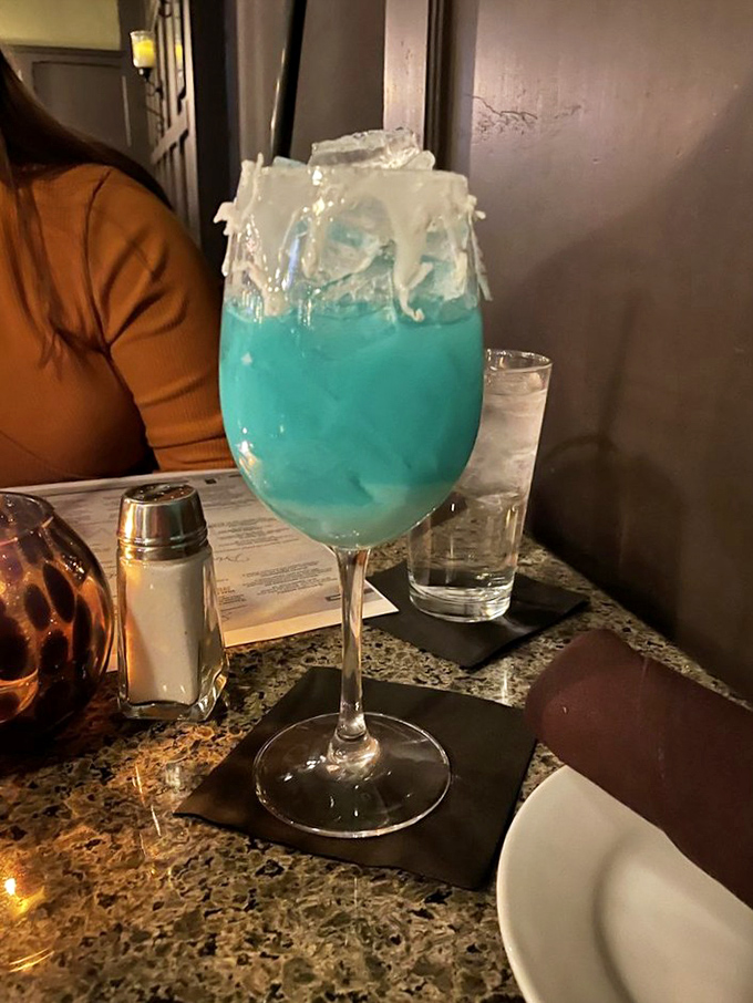 This electric blue cocktail isn't just a drink&mdash;it's vacation in a glass, with a side of "I'll worry about adulting tomorrow."