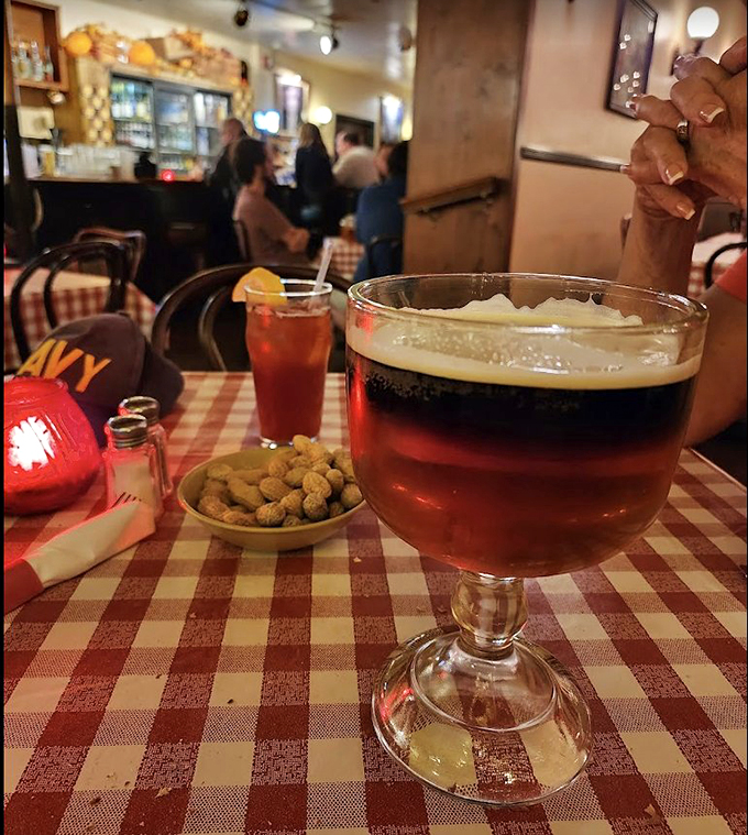 A proper goblet of beer alongside peanuts&mdash;the perfect pairing since... well, forever. Some traditions exist because they're simply right.