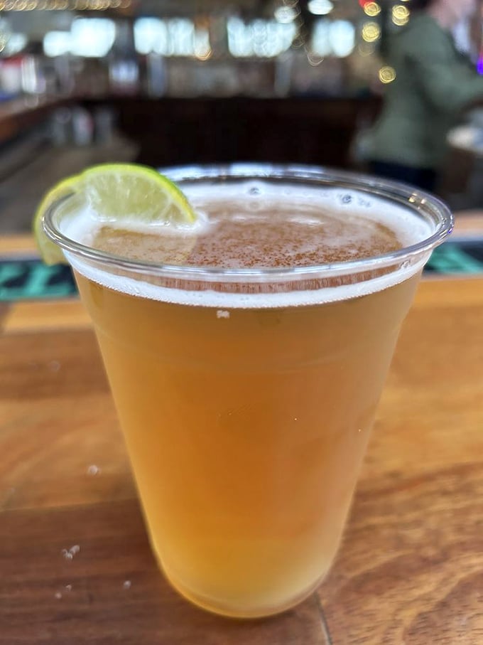 A cold beer with a lime wedge&mdash;the official beverage of "I've escaped the real world for a few blessed hours."
