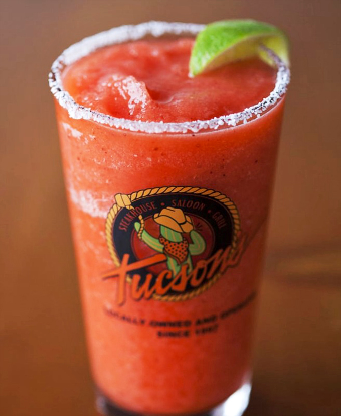 That salt-rimmed strawberry margarita isn't just a drink—it's vacation in a glass. The perfect companion for when your steak needs a worthy sidekick.