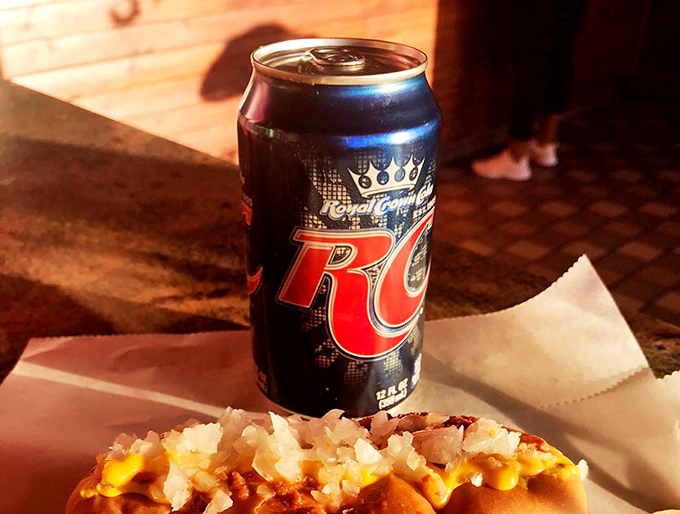 The perfect pairing: an ice-cold RC Cola alongside a hot dog masterpiece. Some relationships are just meant to be.