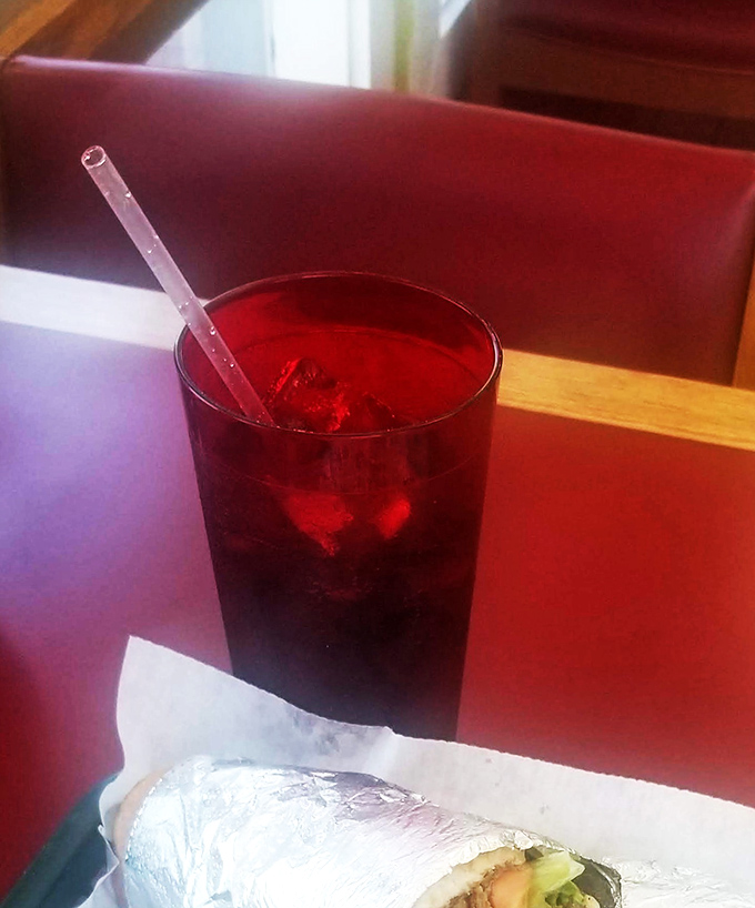 That ruby-red sweet tea isn't just a beverage&mdash;it's liquid Southern hospitality, served ice-cold with enough sugar to power a small town.