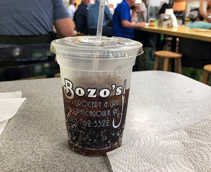 Even the drinks at Bozo's come with a side of local pride. That straw is your direct pipeline to Mississippi refreshment.