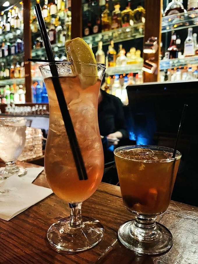 The bar doesn't just mix drinks&mdash;it creates liquid companions for your seafood adventure. That tall one is practically winking at you.