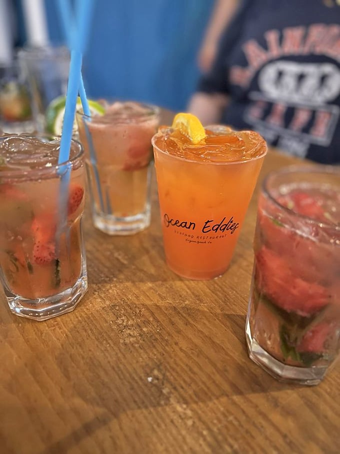 Colorful cocktails lined up like a beachside sunset, each glass promising a different kind of vacation in liquid form.