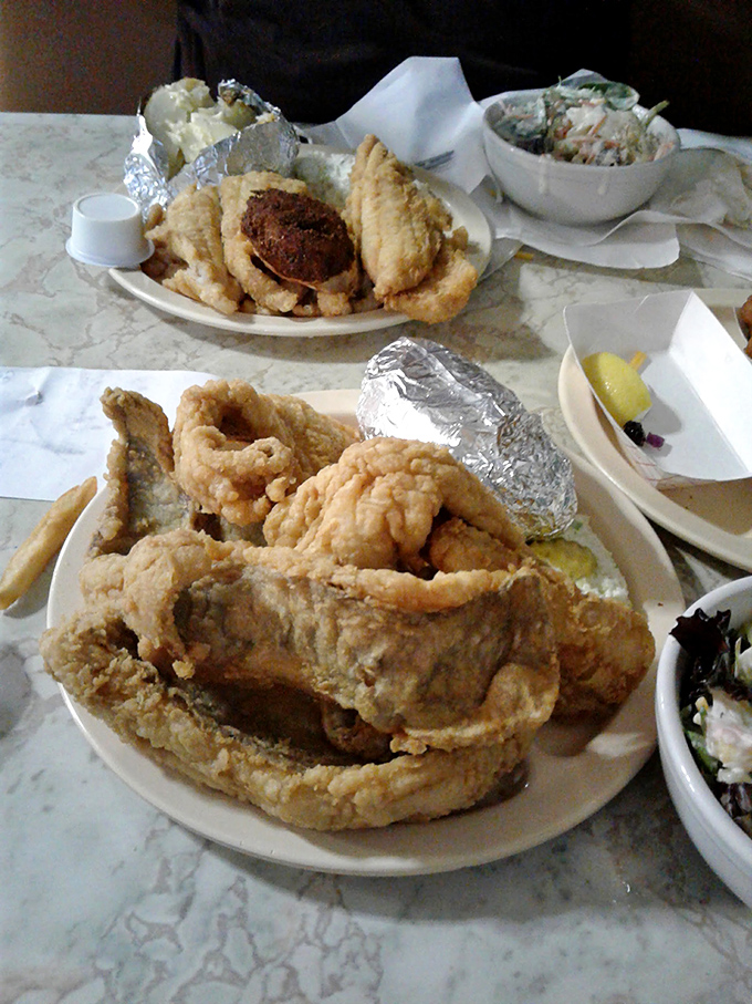 This isn't just dinner; it's an event. When flounder is fried this perfectly, everything else on the table becomes a supporting actor.