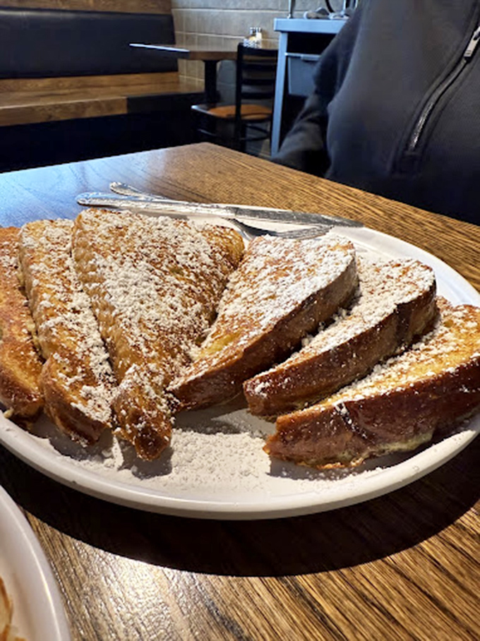 French toast that makes you question why you'd ever eat anything else for breakfast. Powdered sugar snowfall on golden-brown perfection.
